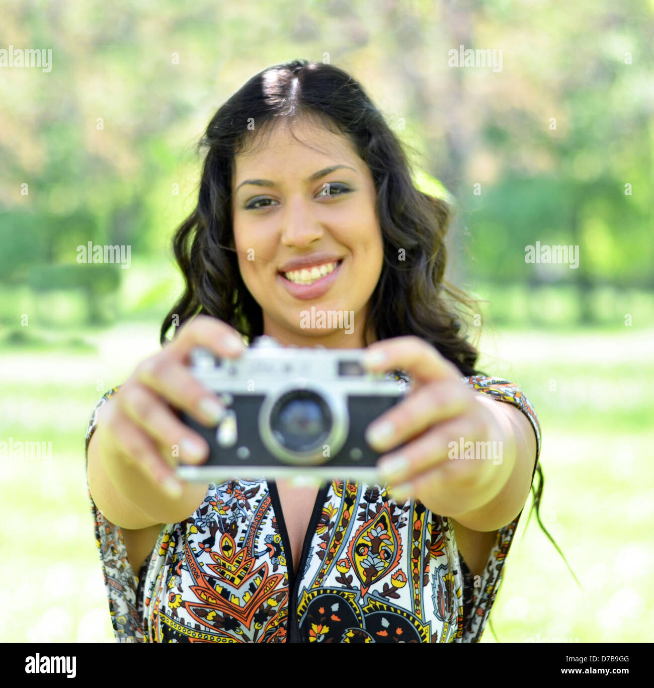 Portrait of beautiful woman taking picture mwith vintage camera Stock ...