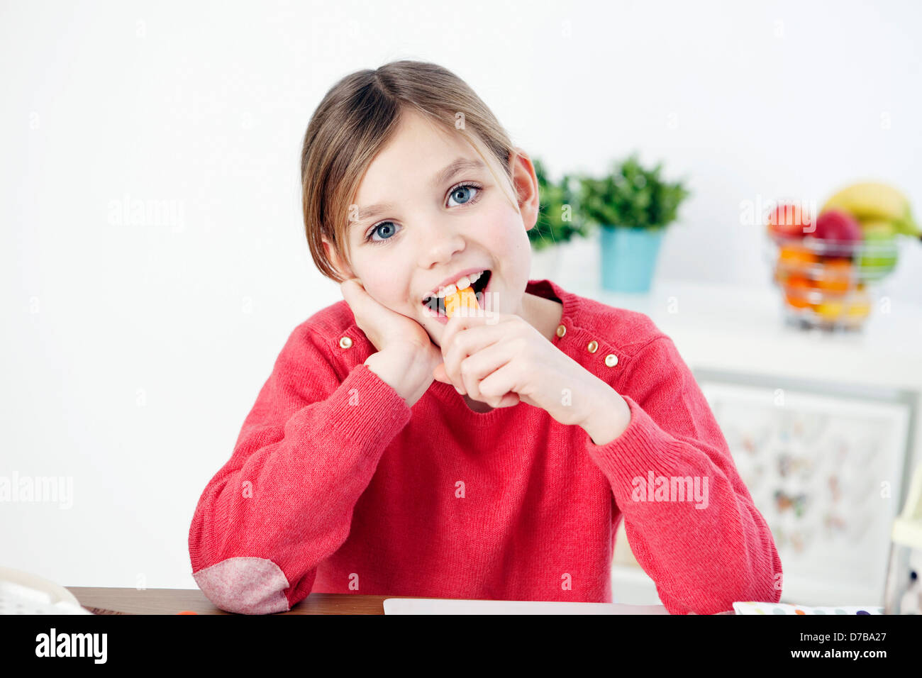 CHILD EATING VEGETABLE Stock Photo - Alamy