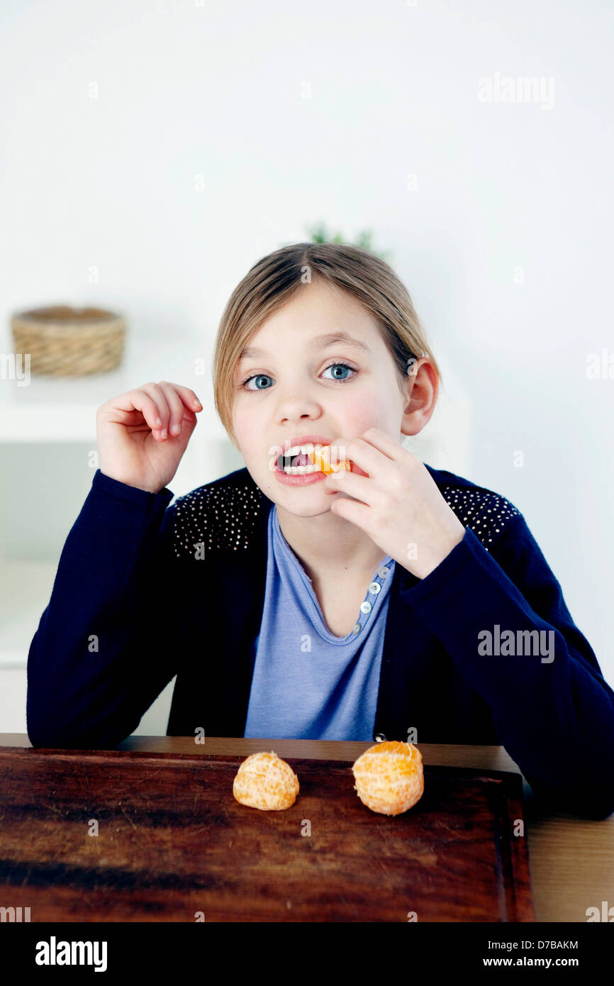 CHILD EATING FRUIT Stock Photo - Alamy