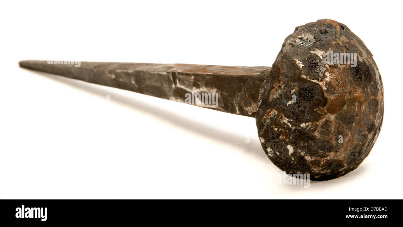 A close up of a very big iron nail, as viewed from beside it. Isolated ...