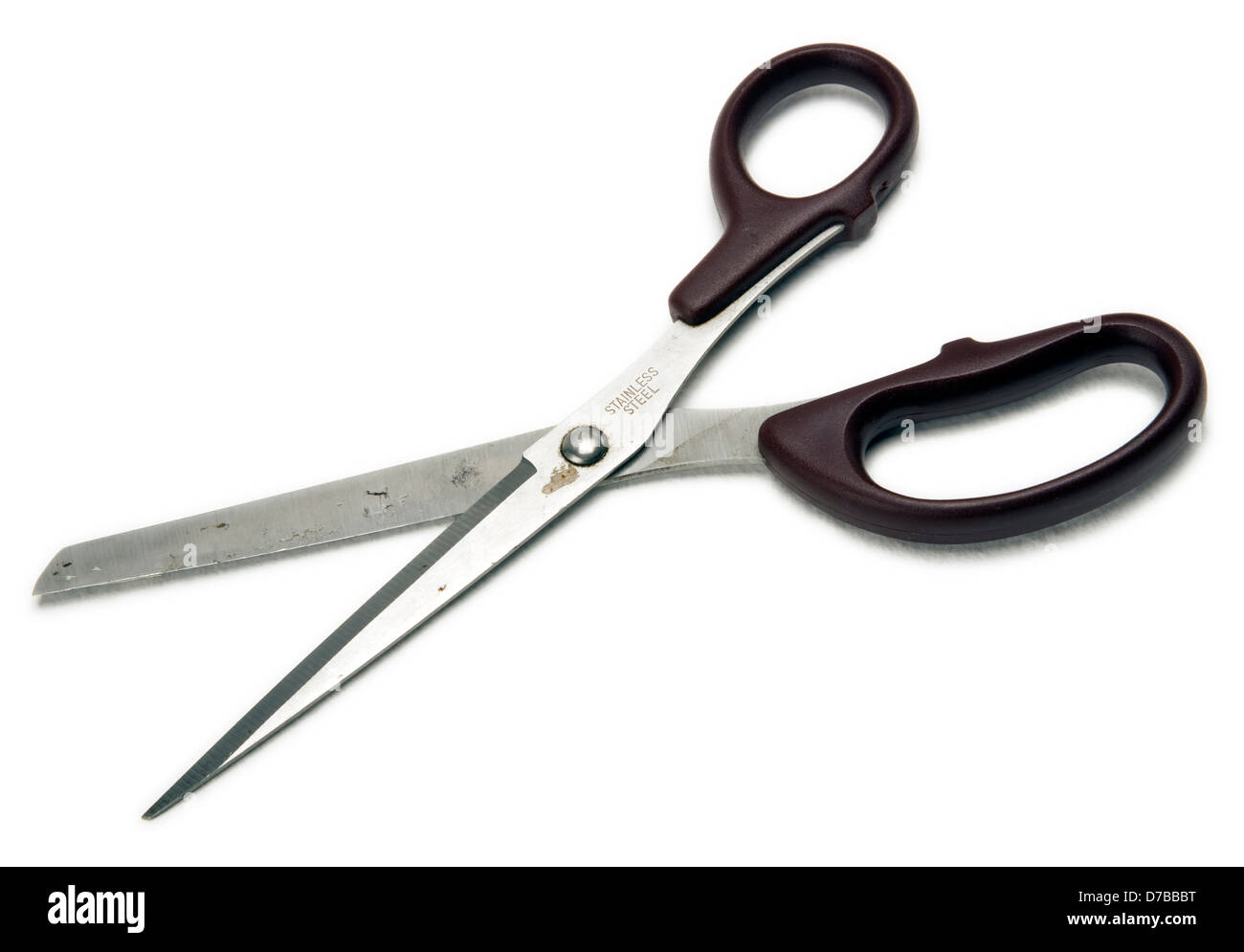 An opened pair of scissors with black handles isolated on white ...