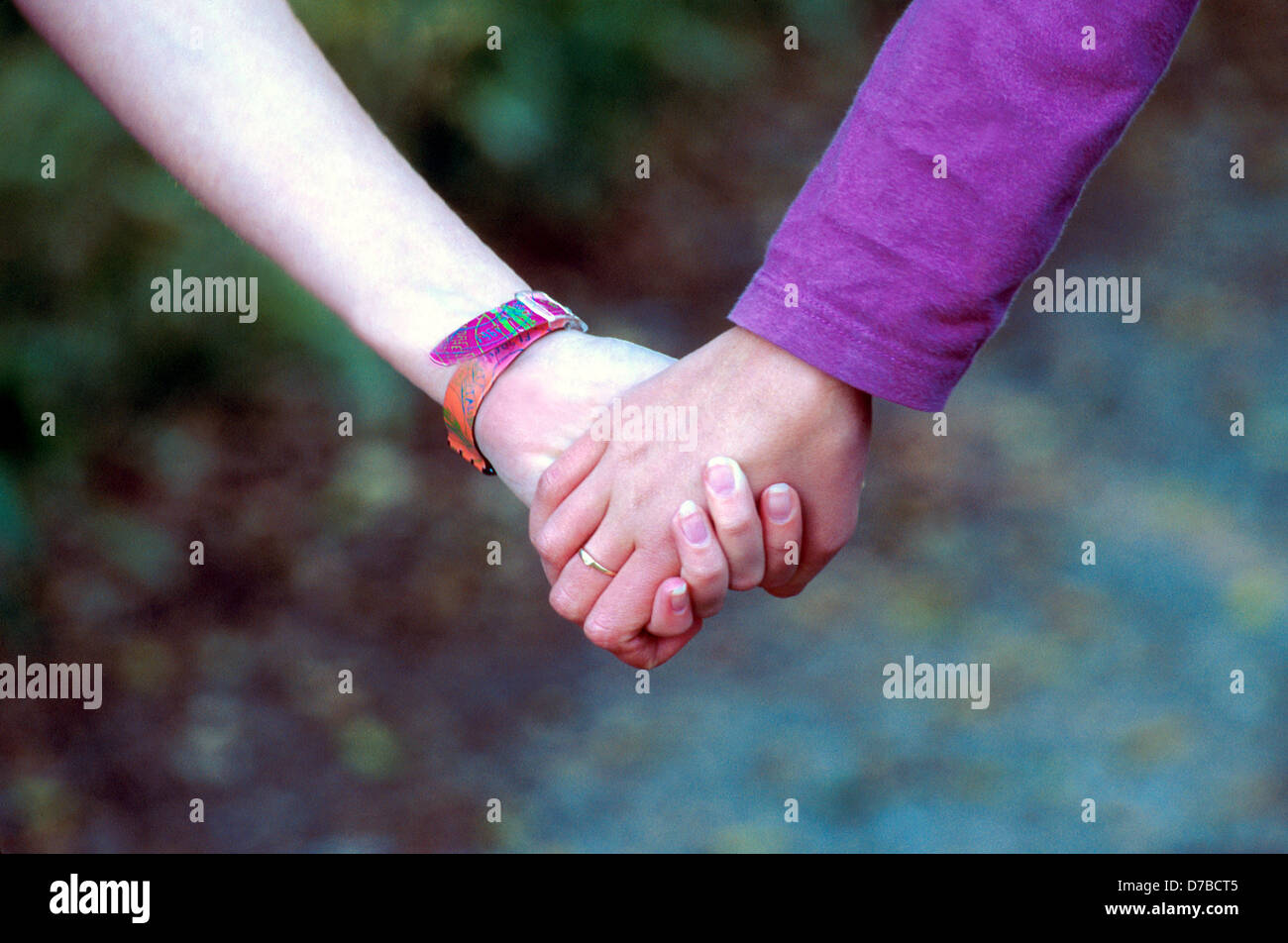 Hand in hand Stock Photo - Alamy