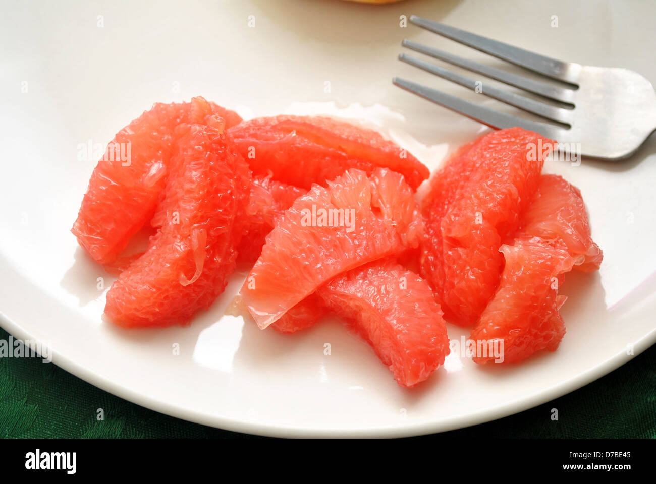 Eating Peeled Pink Grapefruit Stock Photo - Alamy