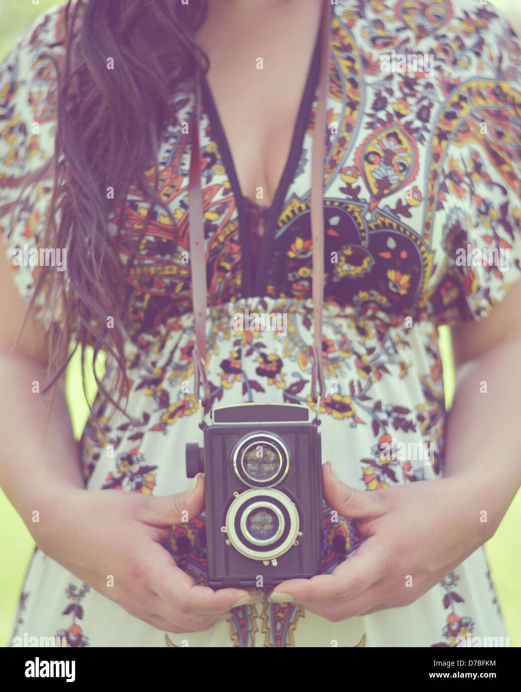 Retro image of woman hands holding vintage camera outdoors Stock Photo ...