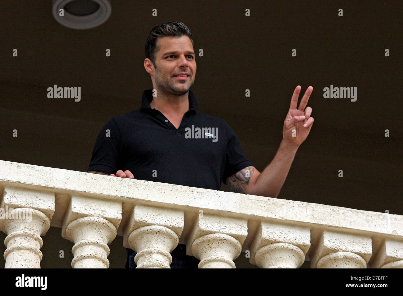 Ricky Martin posing on a balcony at the Trump International Golf Club ...
