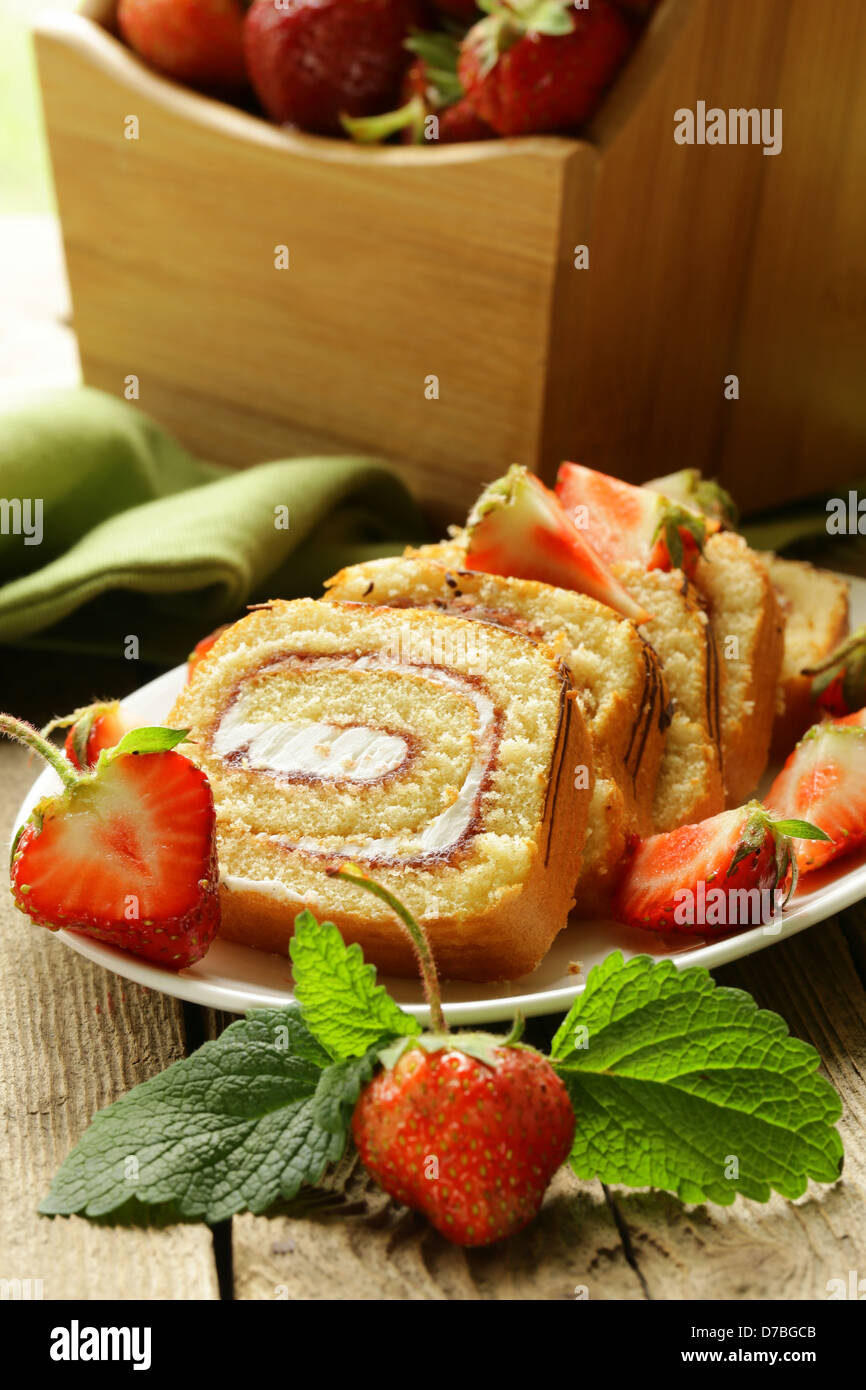 roulade cake with cream and fresh strawberries Stock Photo - Alamy