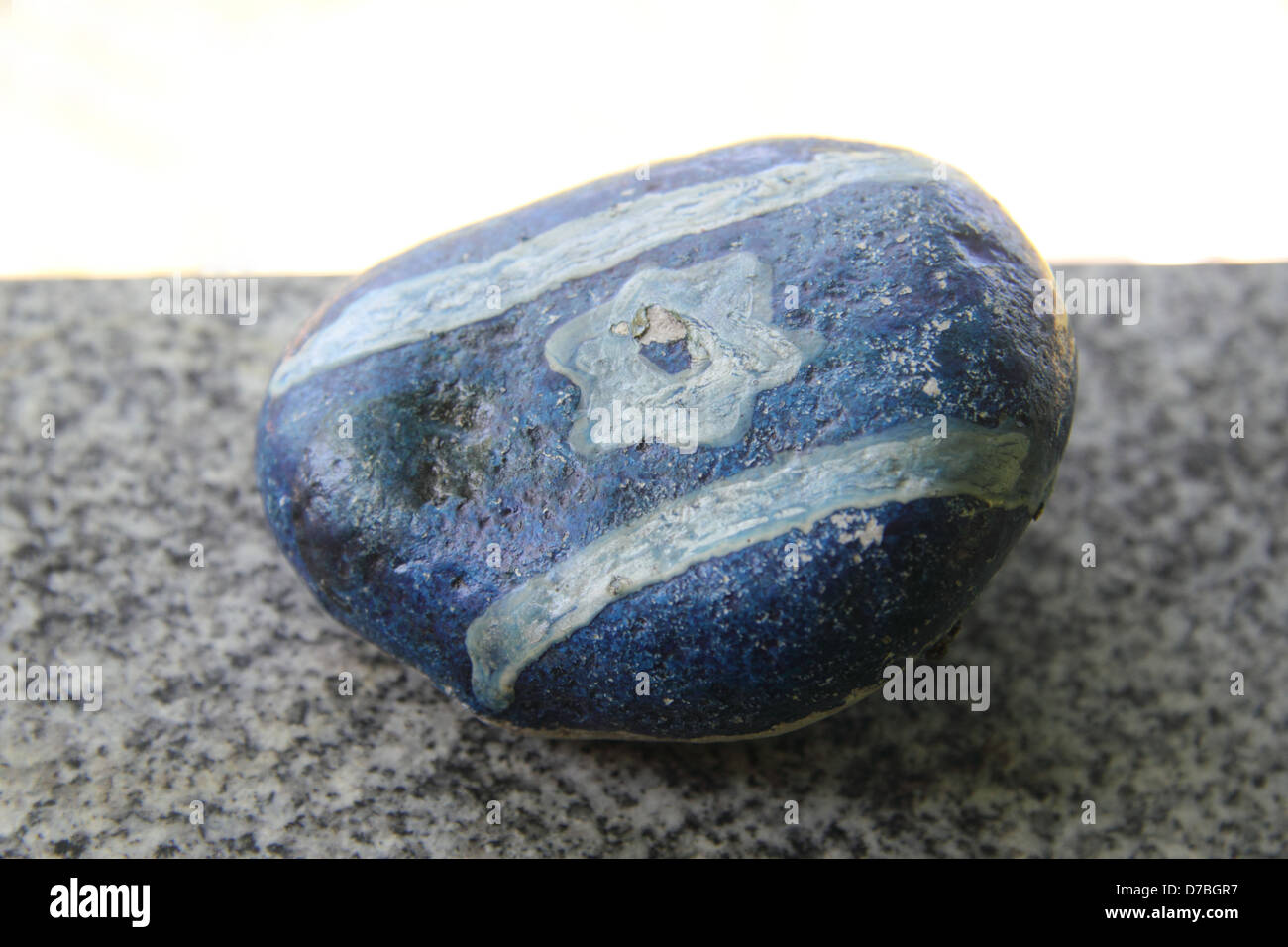 Memorial pebble placed at the children's common grave in the Jewish ...