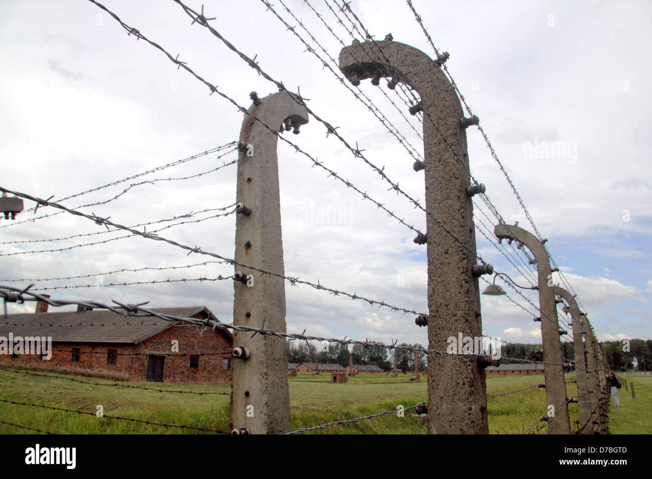 Barbed wired fence surrounding the prisoners' barracks at Auschwitz ...