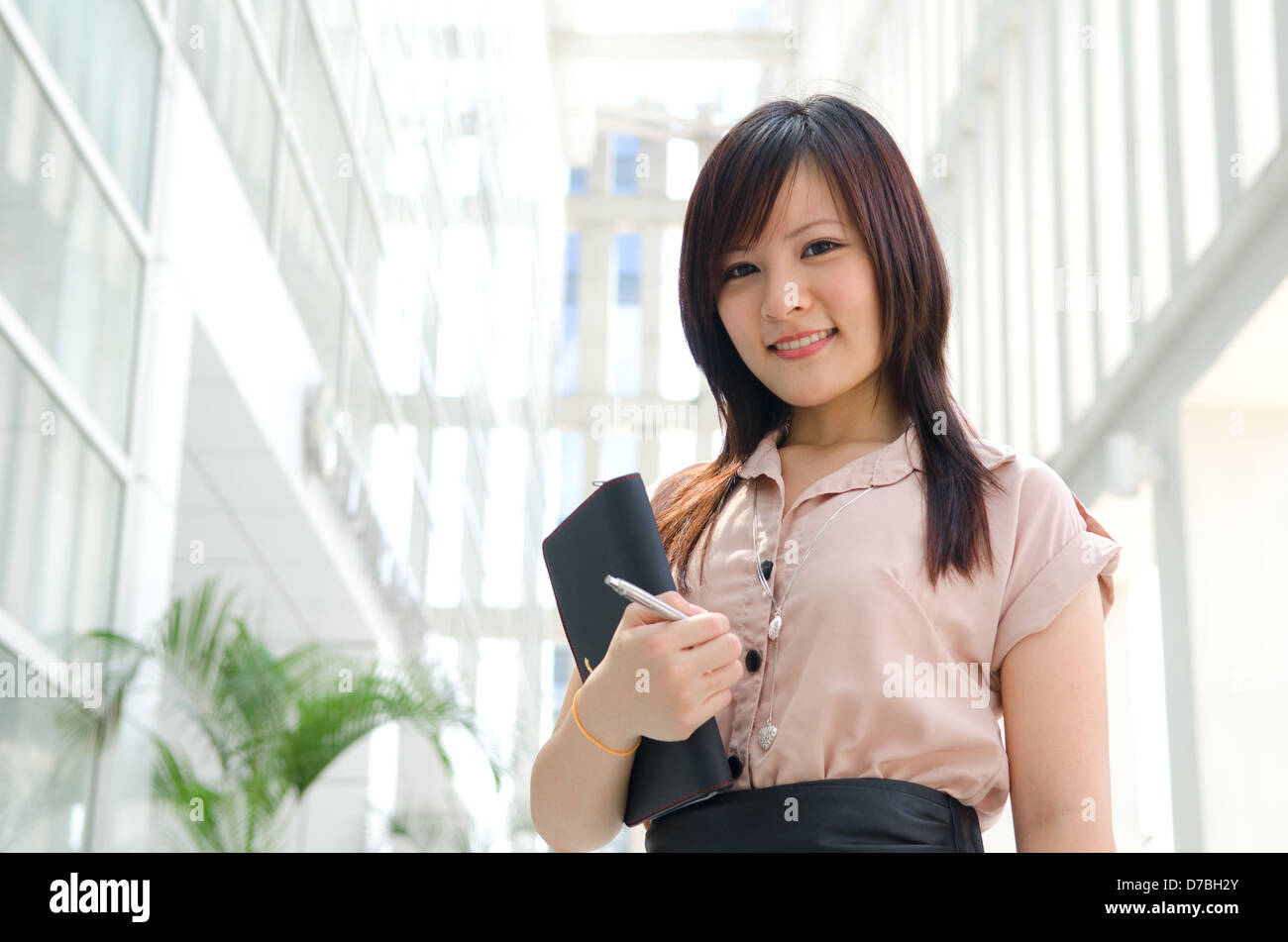 chinese Asian college student on campus with modern background Stock ...