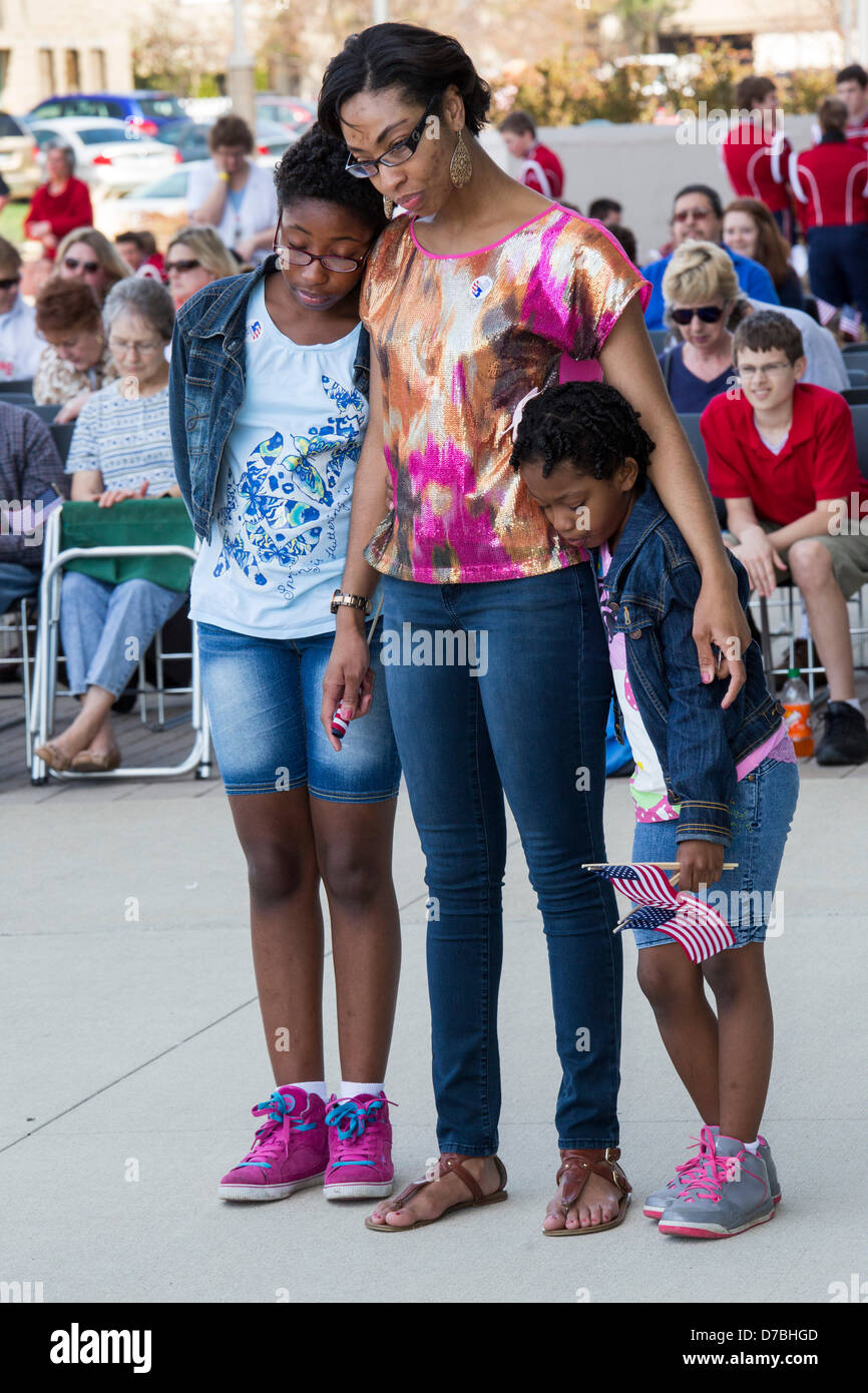 Warren, Michigan, USA. A woman and children pray during the annual ...
