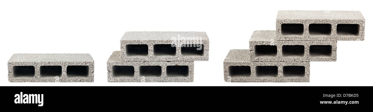 Three gray concrete construction blocks (a.k.a. cinder block breeze ...