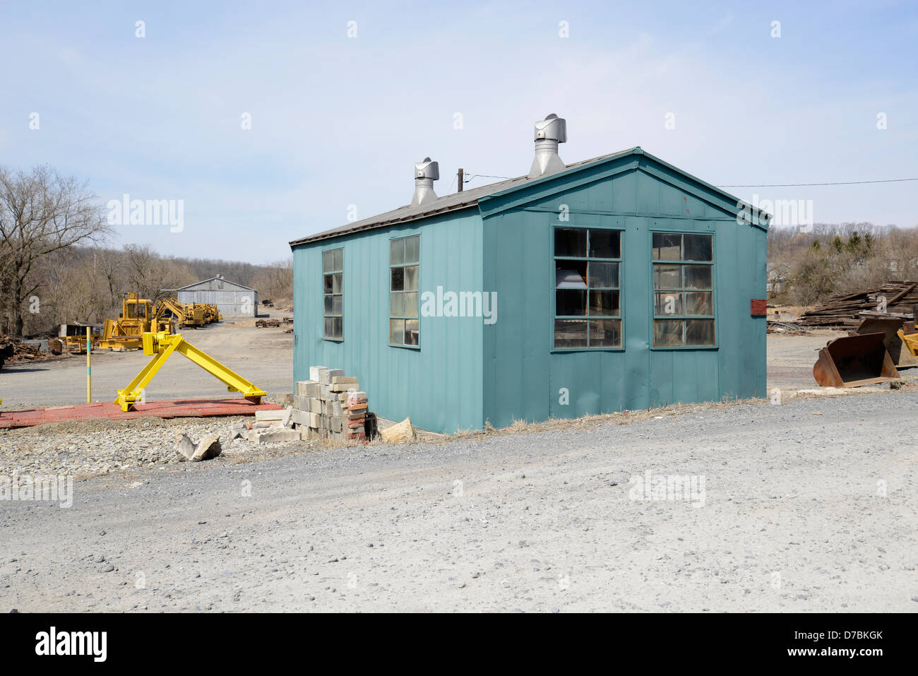 old green shed or utility storage building by a construction area Stock ...
