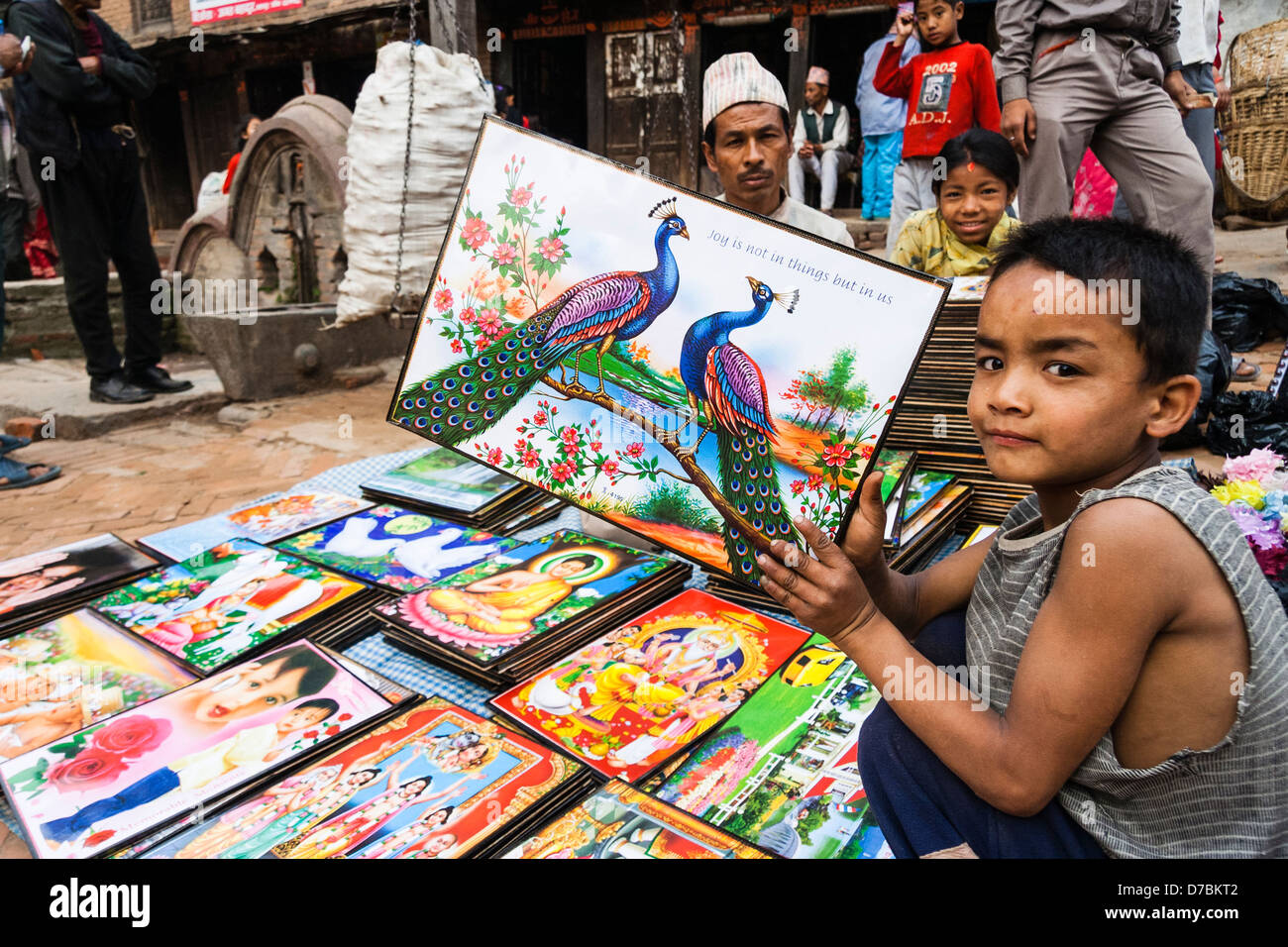 Child and Newari family selling religious and decorative posters during ...
