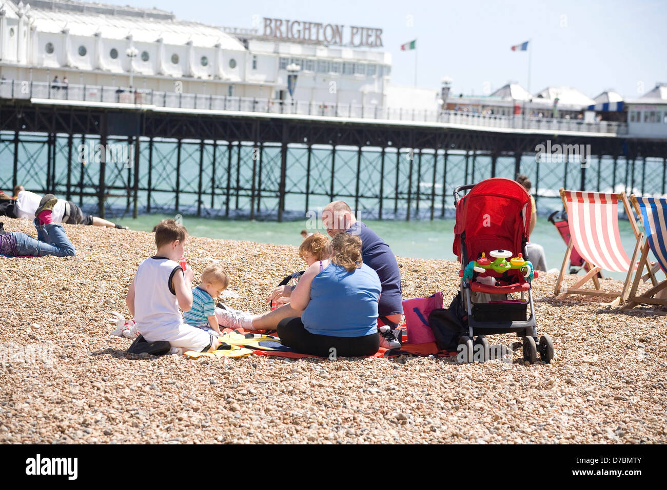 People enjoying the sunshine on Brighton Beach in Sussex, England on ...