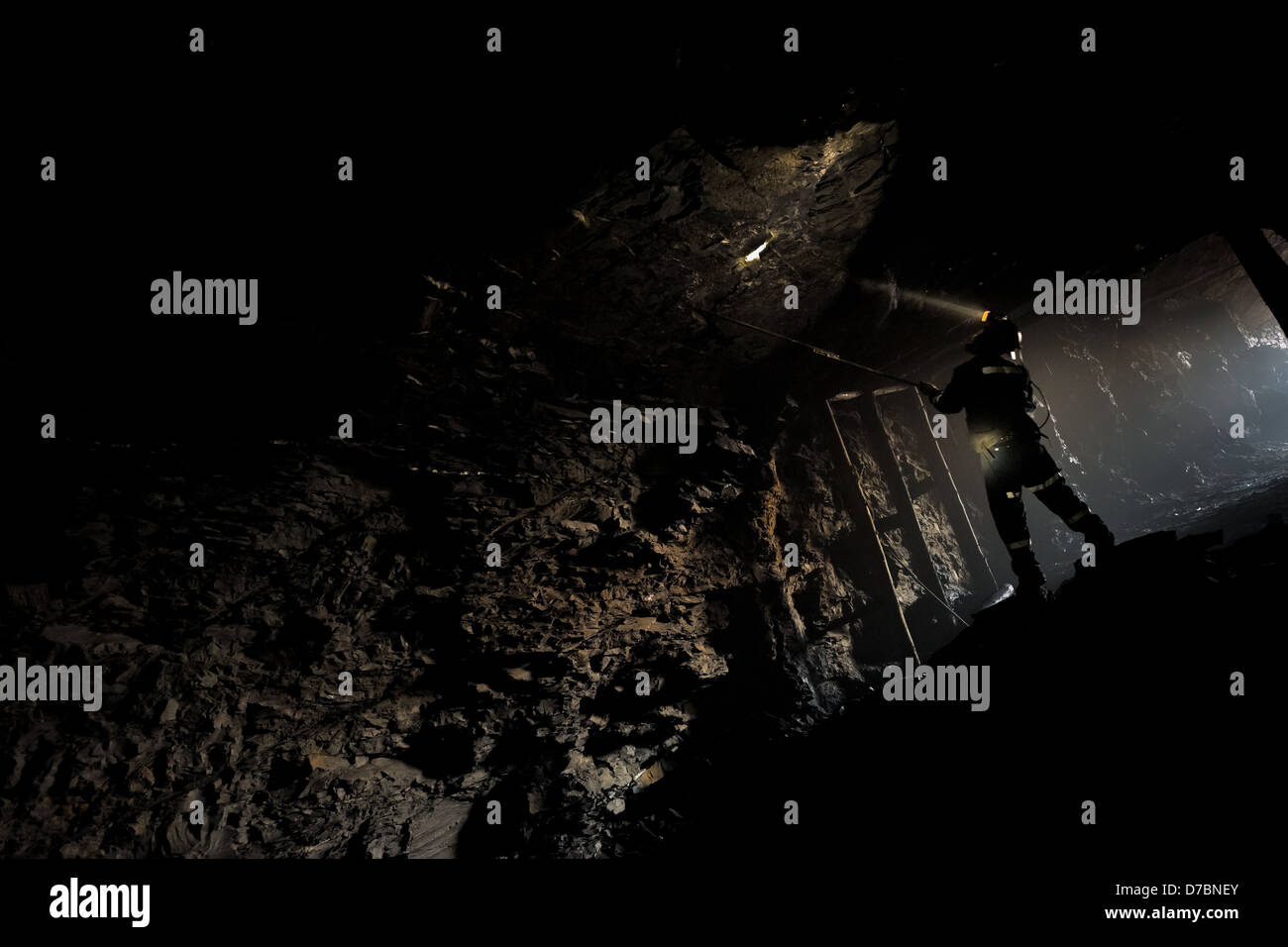 A miner works inside of a gold mine in La Rinconada, Peru Stock Photo ...