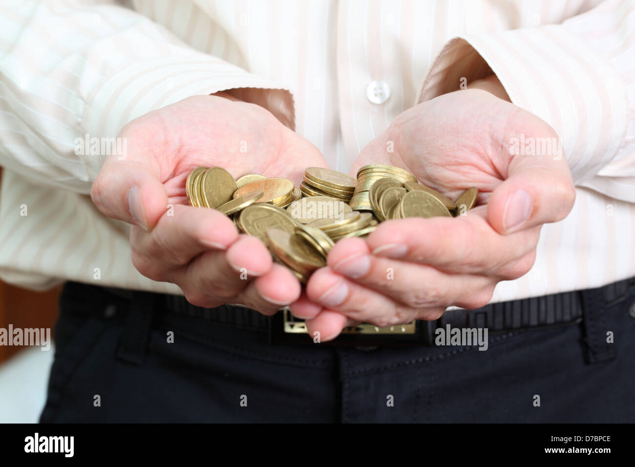 Hand holding pennies hi-res stock photography and images - Alamy