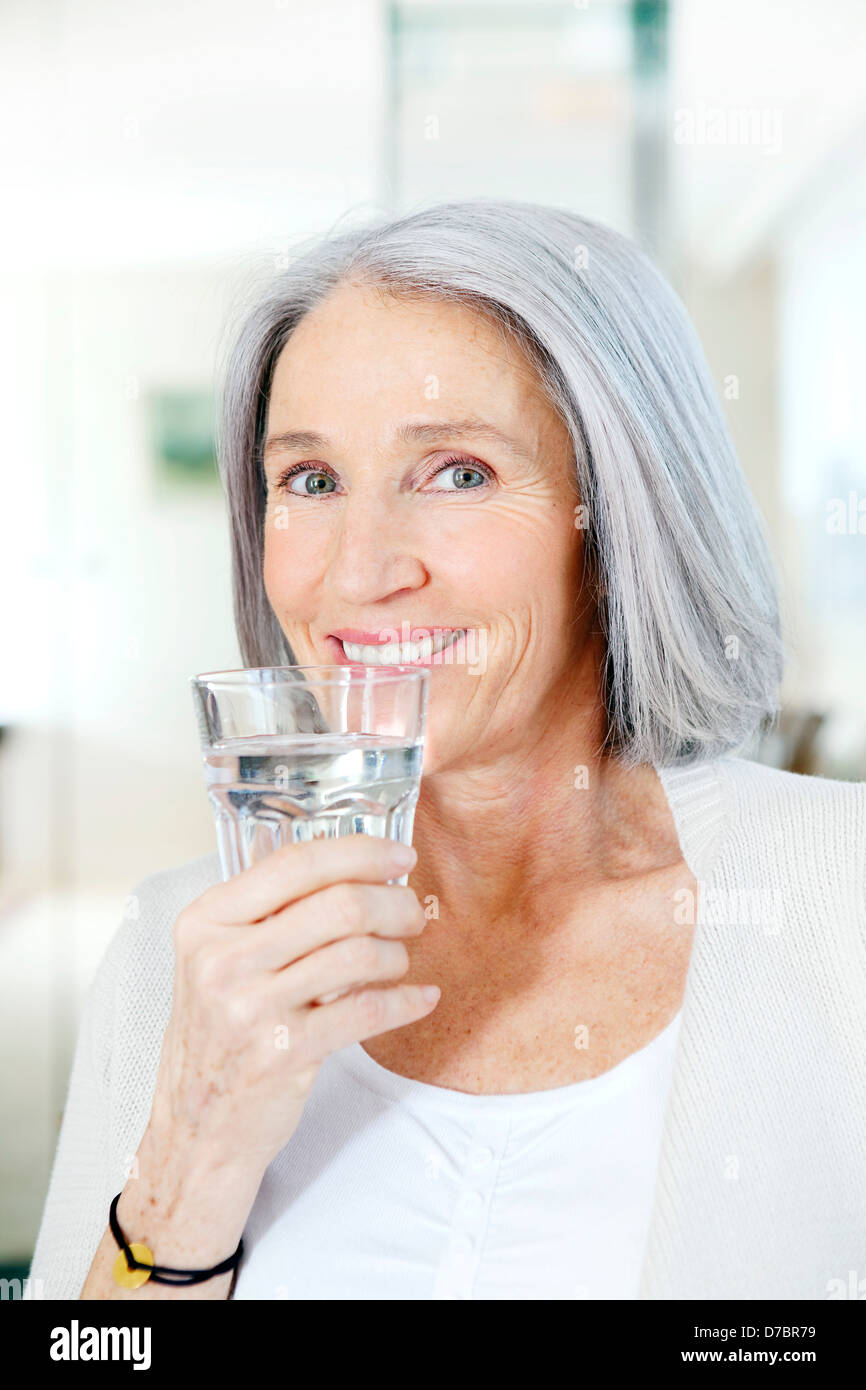 ELDERLY PERSON WITH COLD DRINK Stock Photo - Alamy