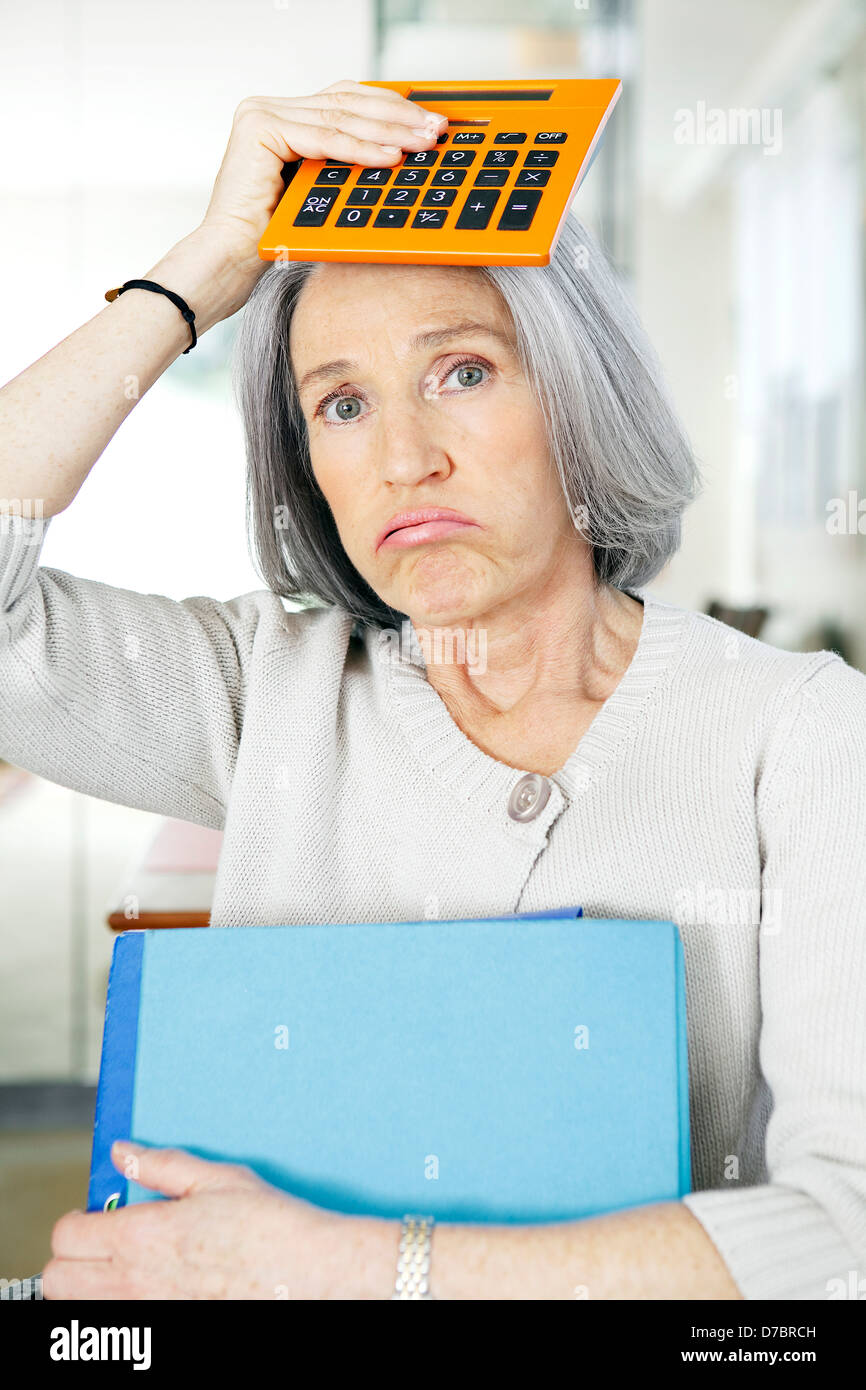 ELDERLY PERSON DOING PAPERWORK Stock Photo - Alamy