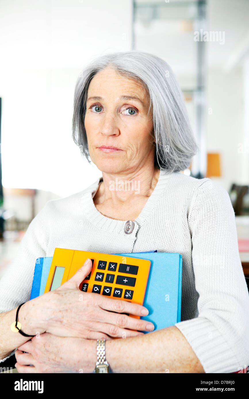 ELDERLY PERSON DOING PAPERWORK Stock Photo - Alamy