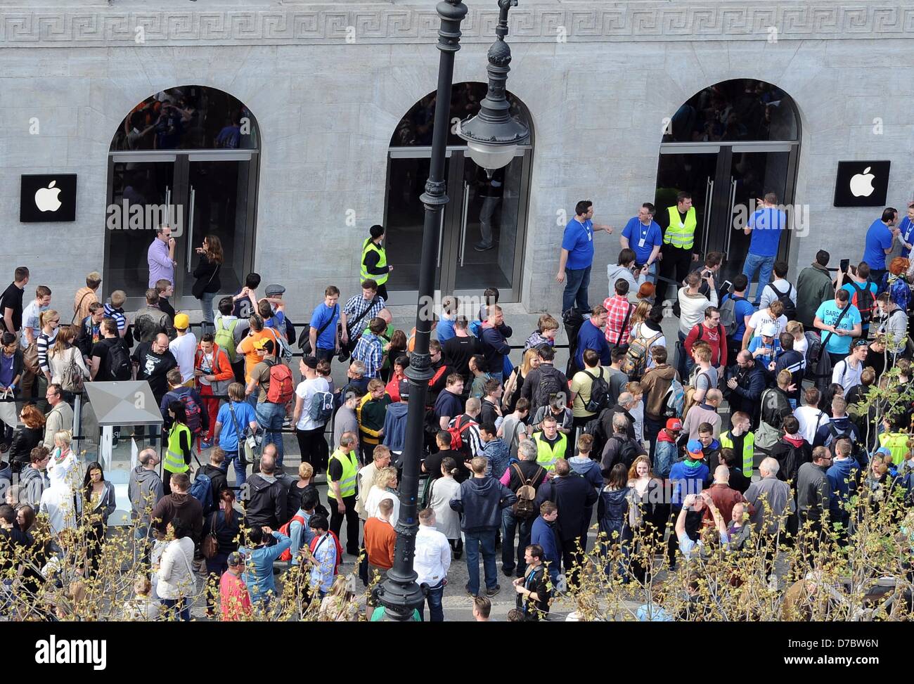 People stand in line and wait for the doors to open outside of the ...