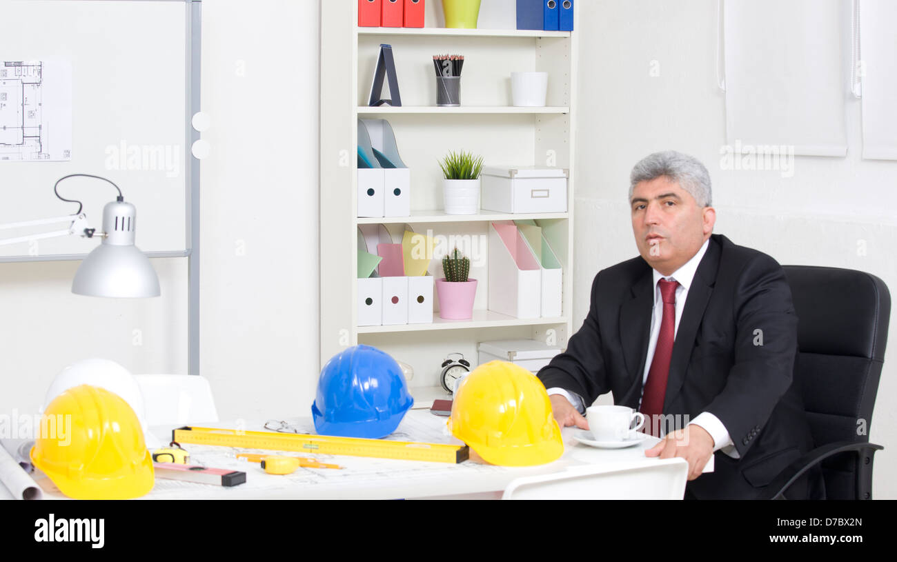 Portrait Of Architect With Blueprint In The Office Stock Photo - Alamy