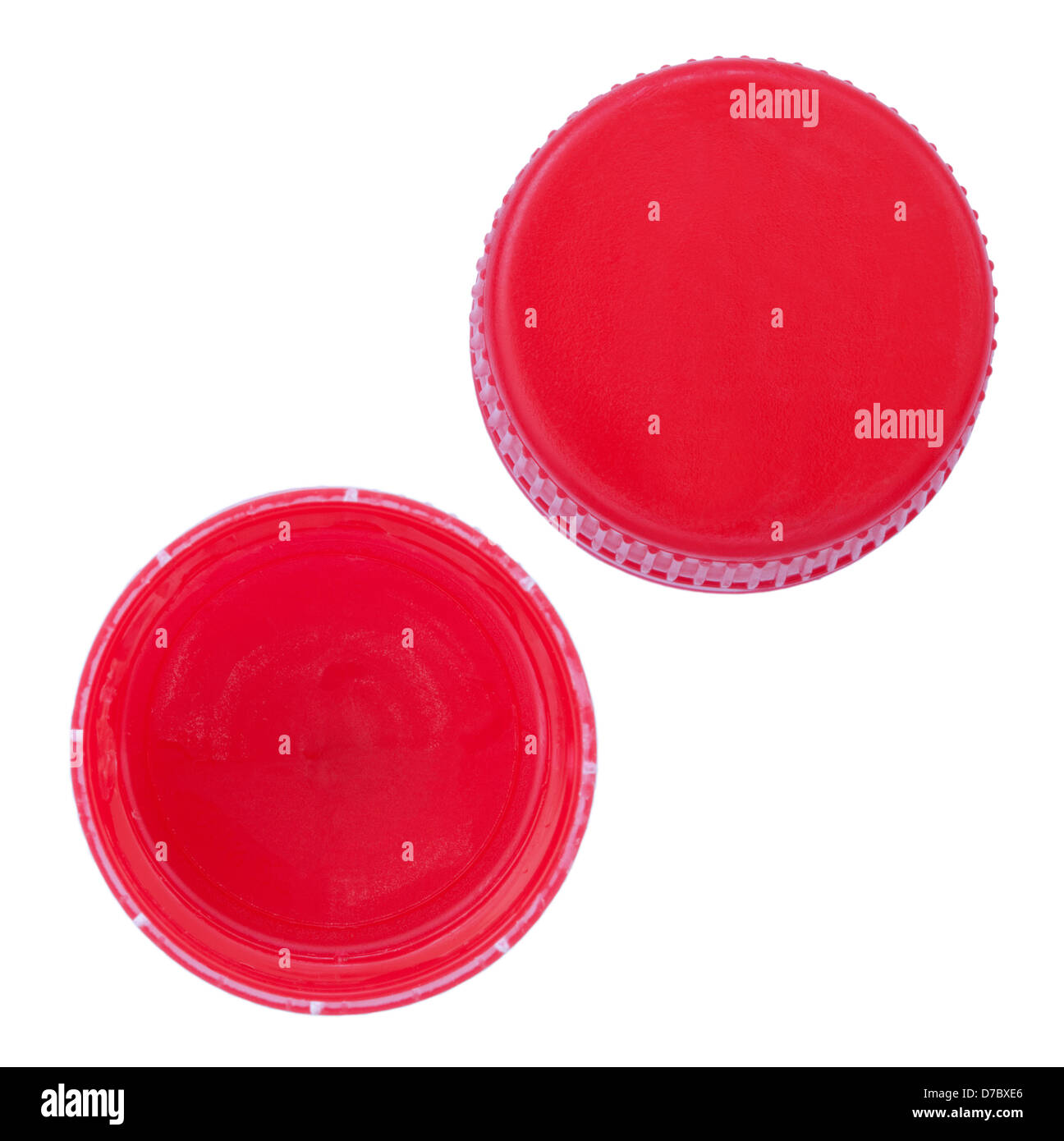 Two angles of a red plastic bottle cap. One of the top side and one of ...