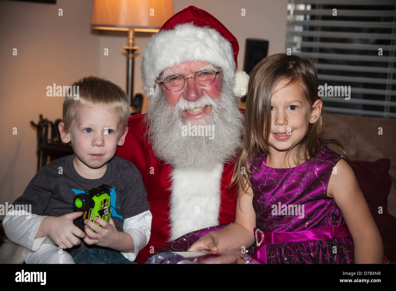 Girl sitting on santa lap hi-res stock photography and images - Alamy