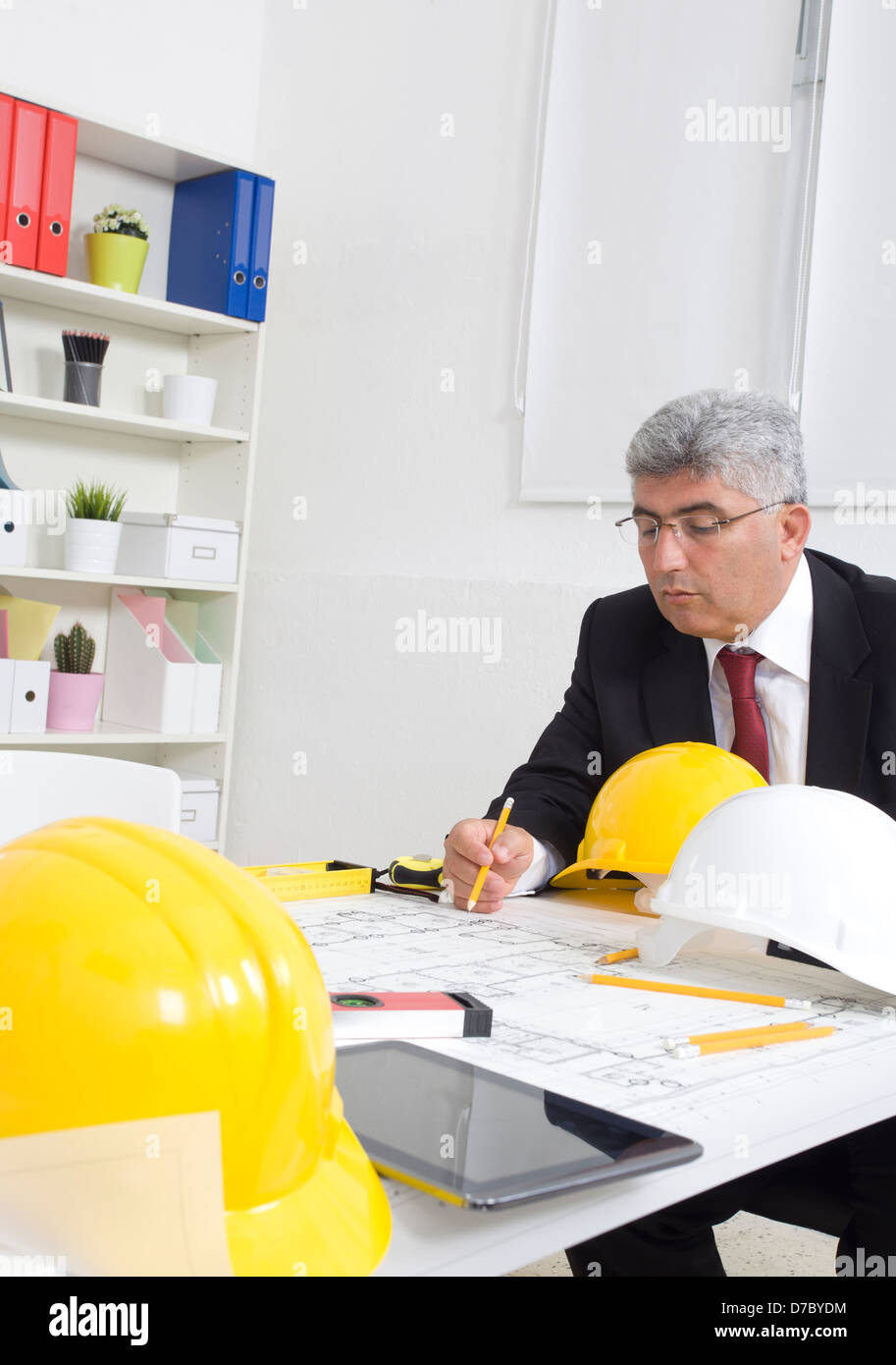 Portrait Of Architect With Blueprint In The Office Stock Photo - Alamy