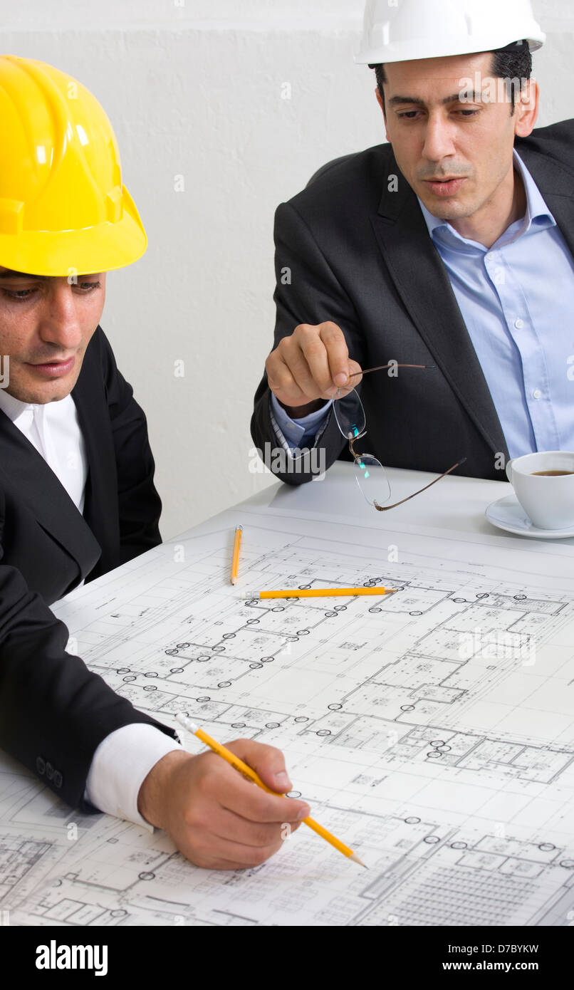 Architects working in office on construction project Stock Photo - Alamy