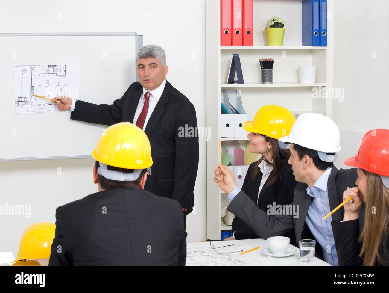 architect giving presentation to a small business group Stock Photo - Alamy
