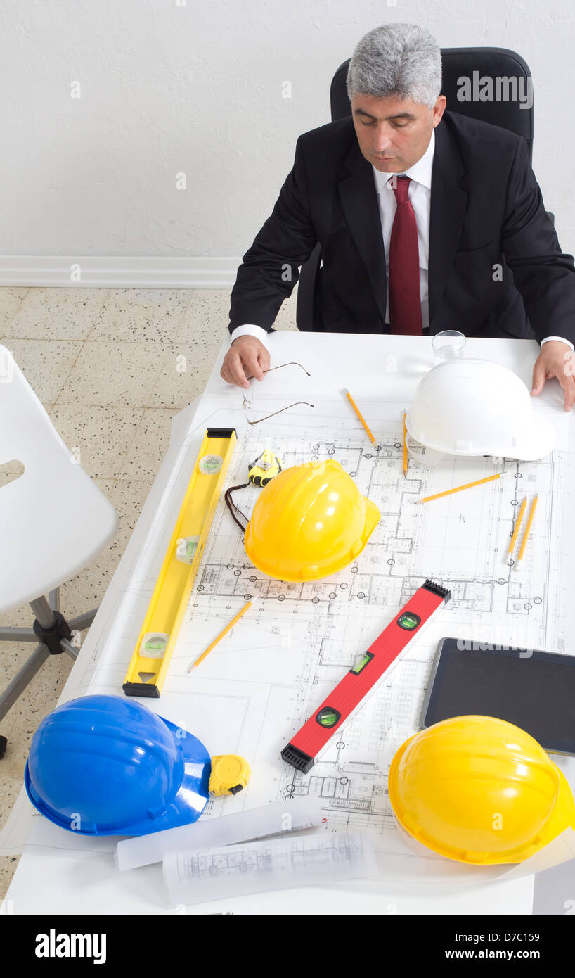 Portrait Of Architect With Blueprint In The Office Stock Photo - Alamy