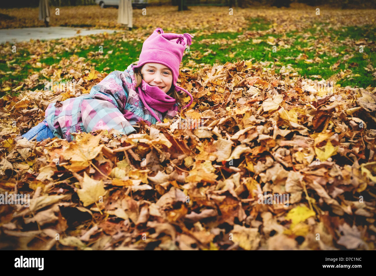 Children playing in pile leaves hi-res stock photography and images - Alamy