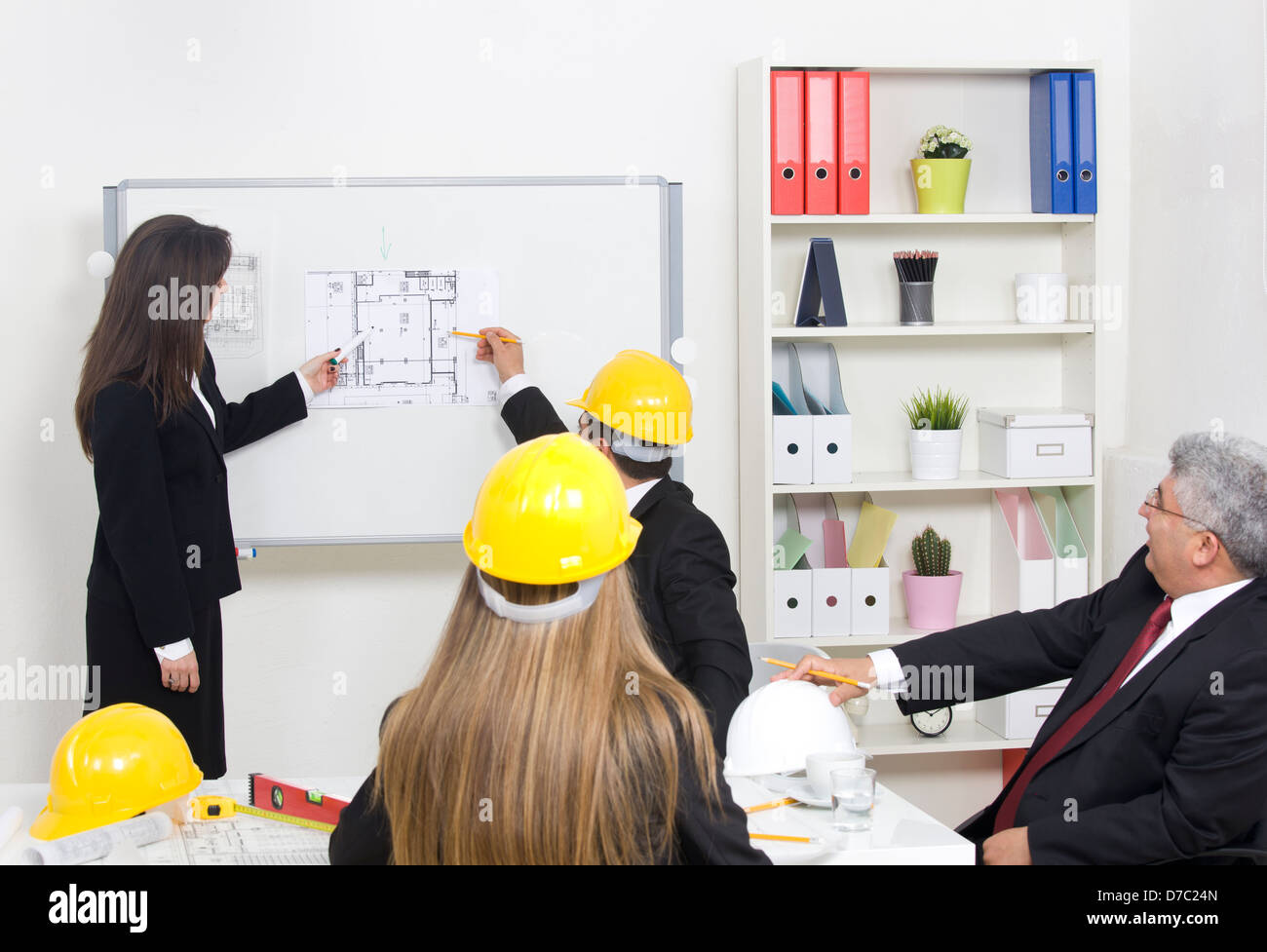 architect giving presentation to a small business group Stock Photo - Alamy