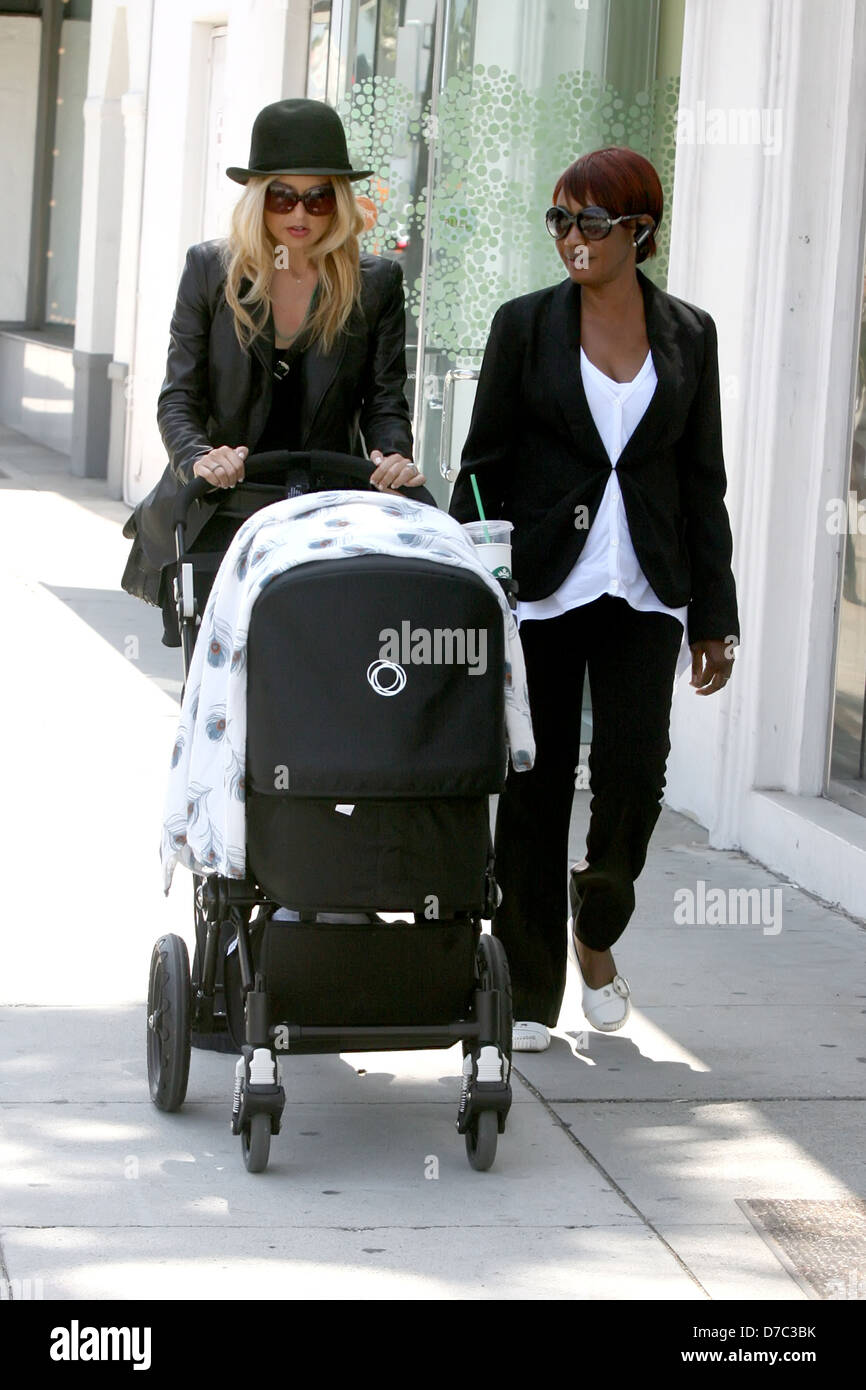 Rachel Zoe pushing a stroller as she walks with her nanny and infant ...