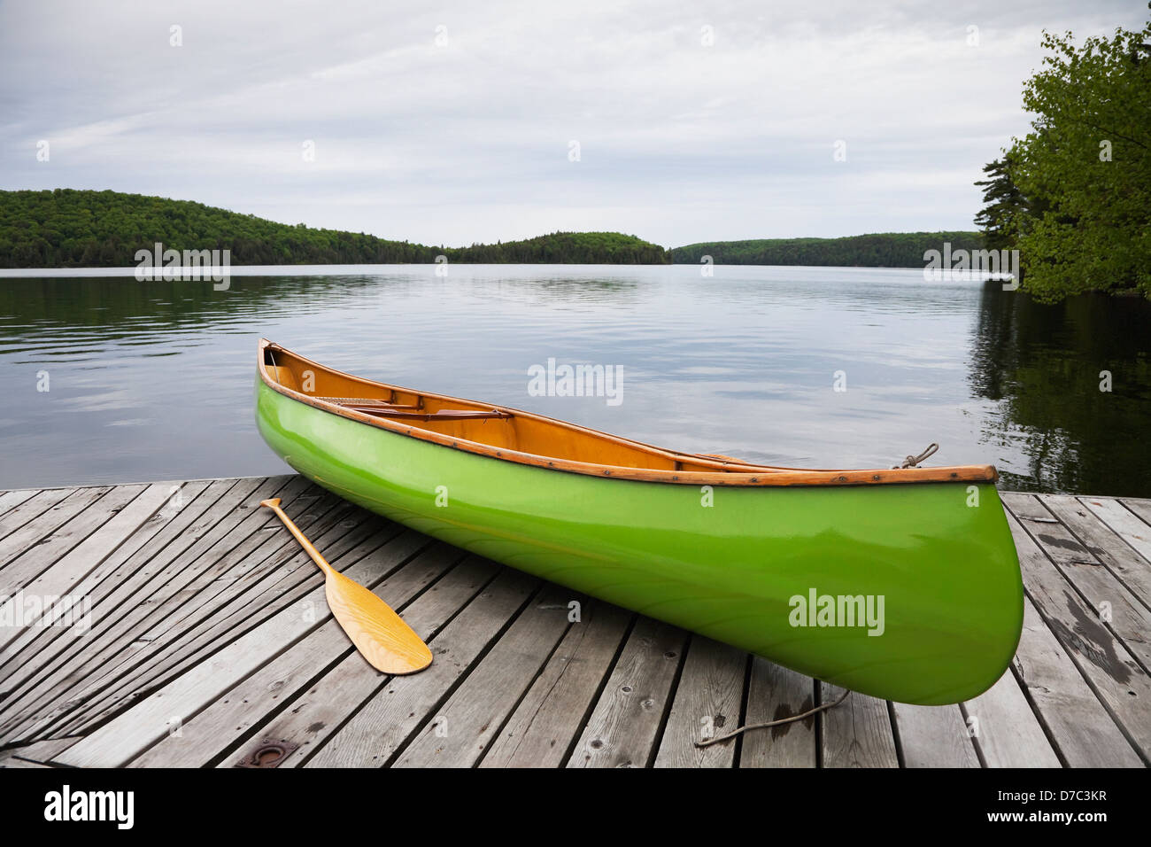 Green Canoe On A Cottage Dock In Algonquin Park;Ontario Canada Stock ...