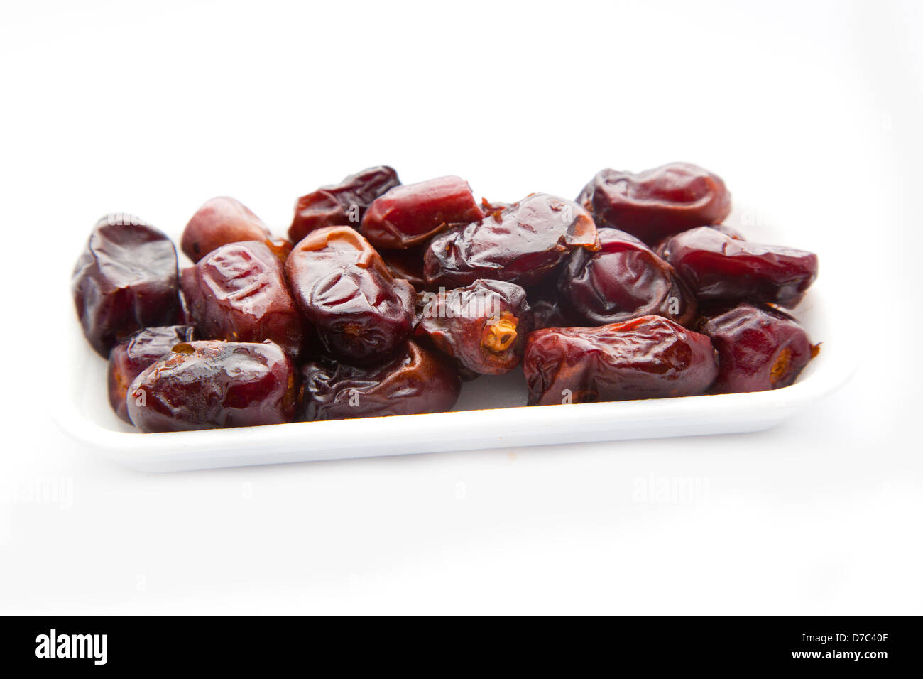 Dried fruits. Dates isolated on white background Stock Photo - Alamy