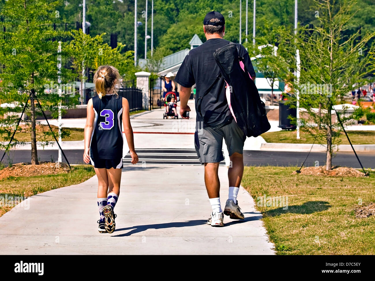 A father taking his daughter to her softball game Stock Photo - Alamy