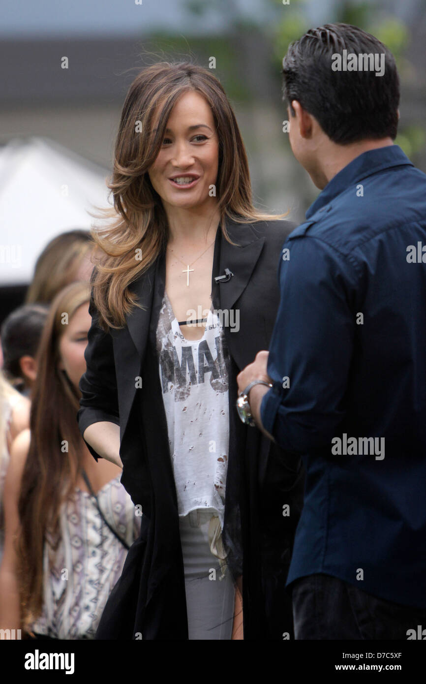 Maggie Q is seen on 'Extra' with Mario Lopez at The Grove in Hollywood ...