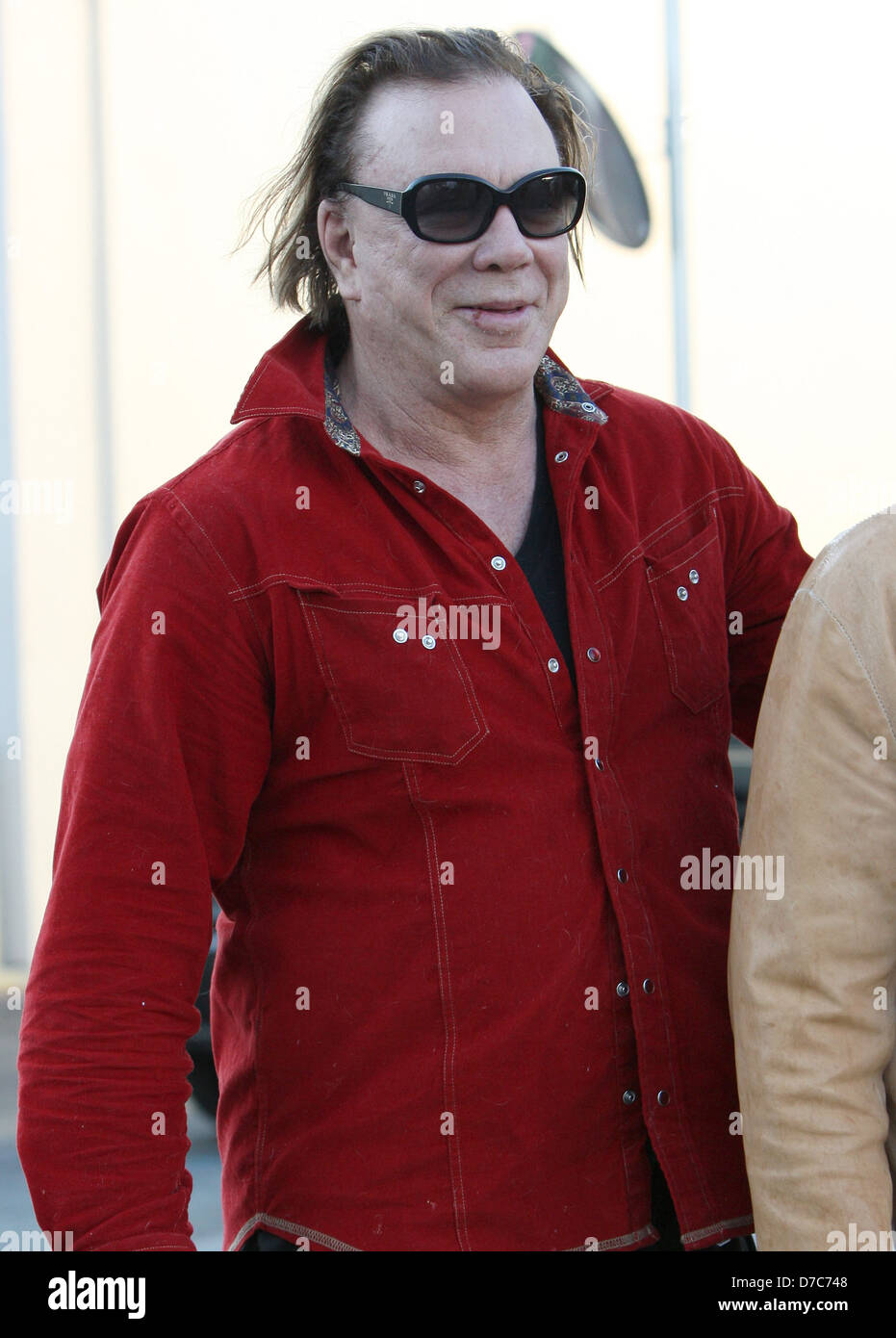 Mickey Rourke exits Cafe Roma in Beverly Hills wearing a red jacket and ...