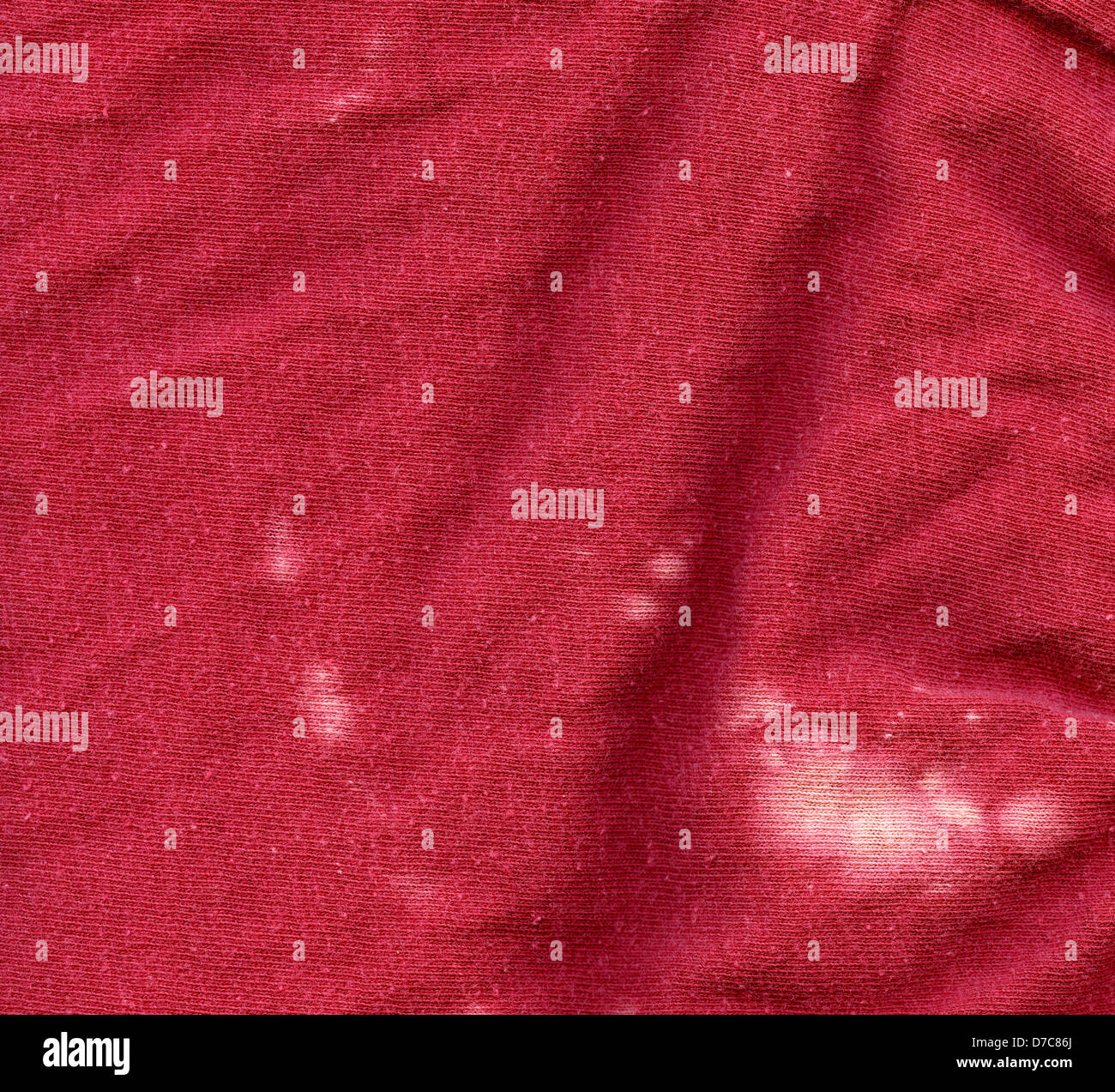 High resolution close up red cotton fabric small bleach stains. Scanned ...