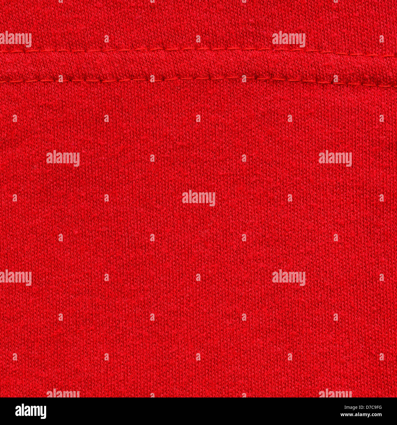 High resolution close up of red cotton fabric with seams crossing ...