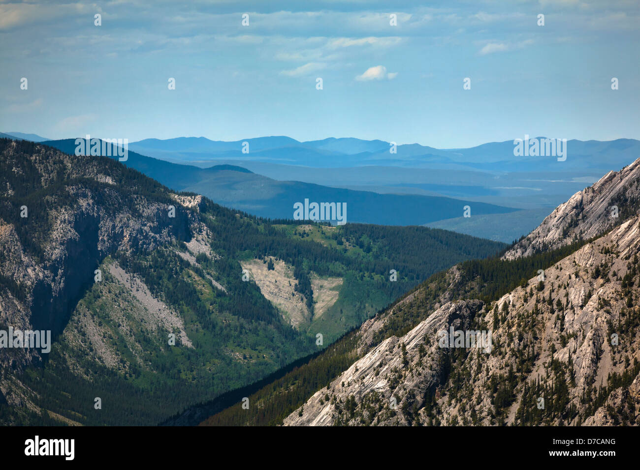 Looking through the rocky mountains out into the forested foothills ...