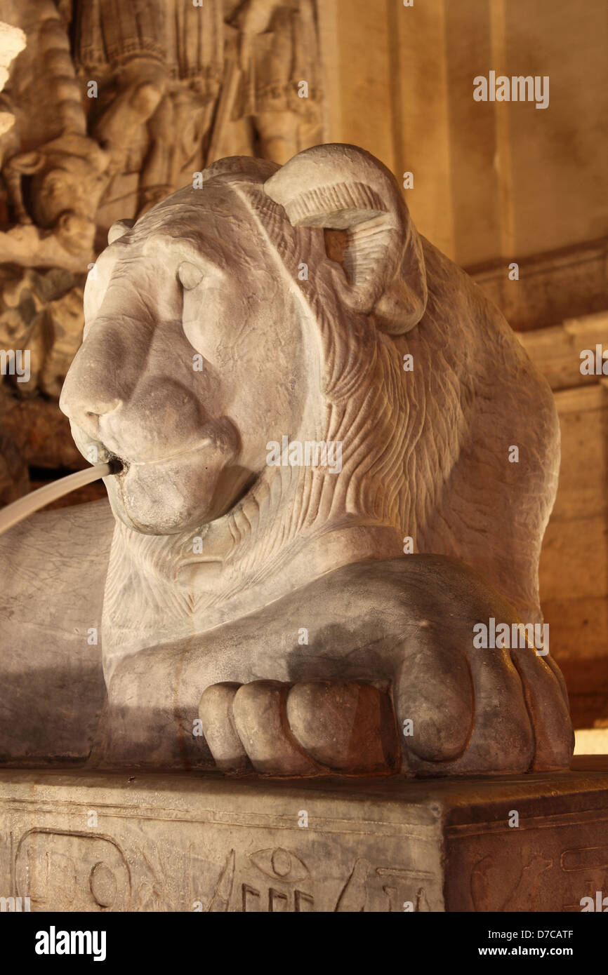 Lion statue spitting water in Moses Fountain, Rome Stock Photo - Alamy