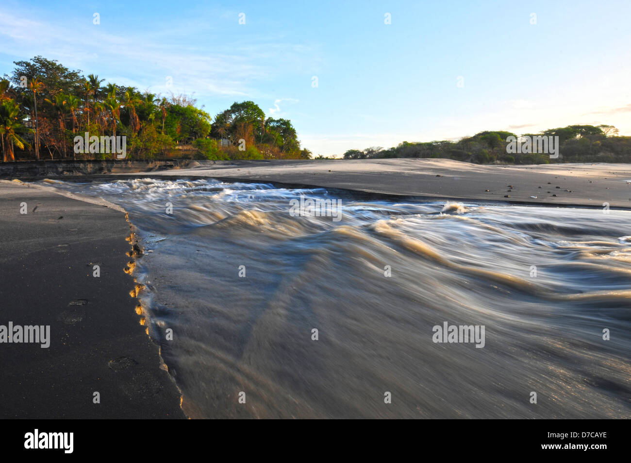 River flowing towards the ocean Stock Photo - Alamy