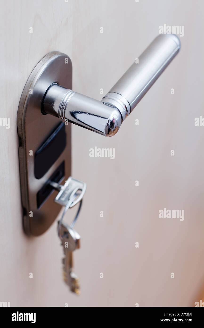A key in a lock at safety door Stock Photo - Alamy