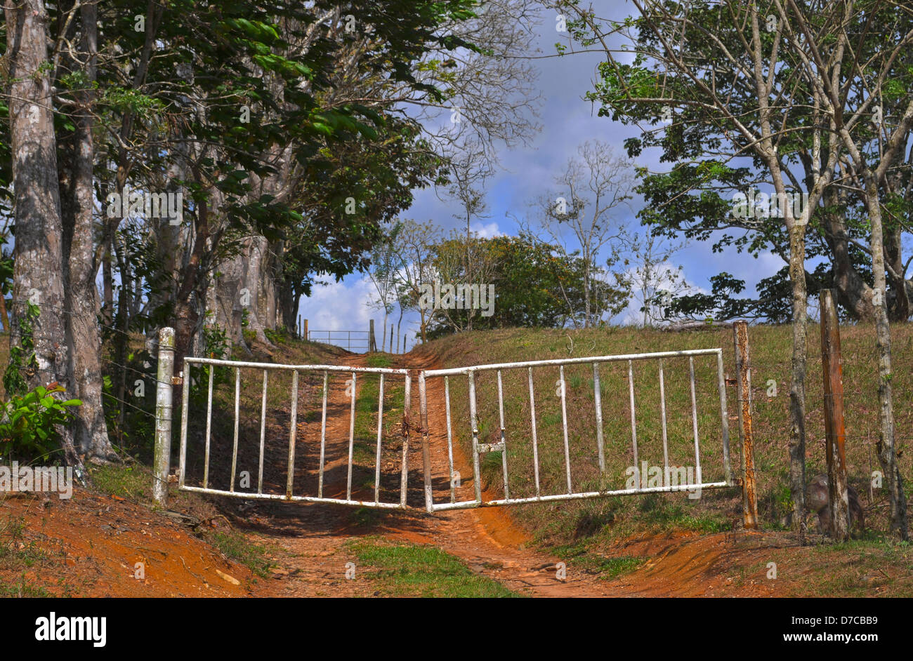 Old iron gate on a small country road Stock Photo - Alamy