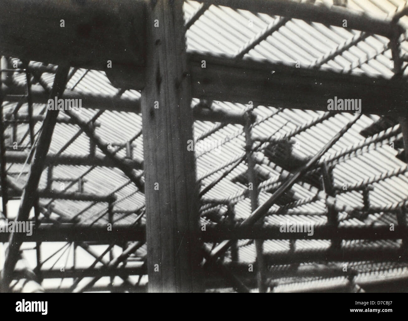 A photograph showing the interior of a factory, focusing on the ceiling ...