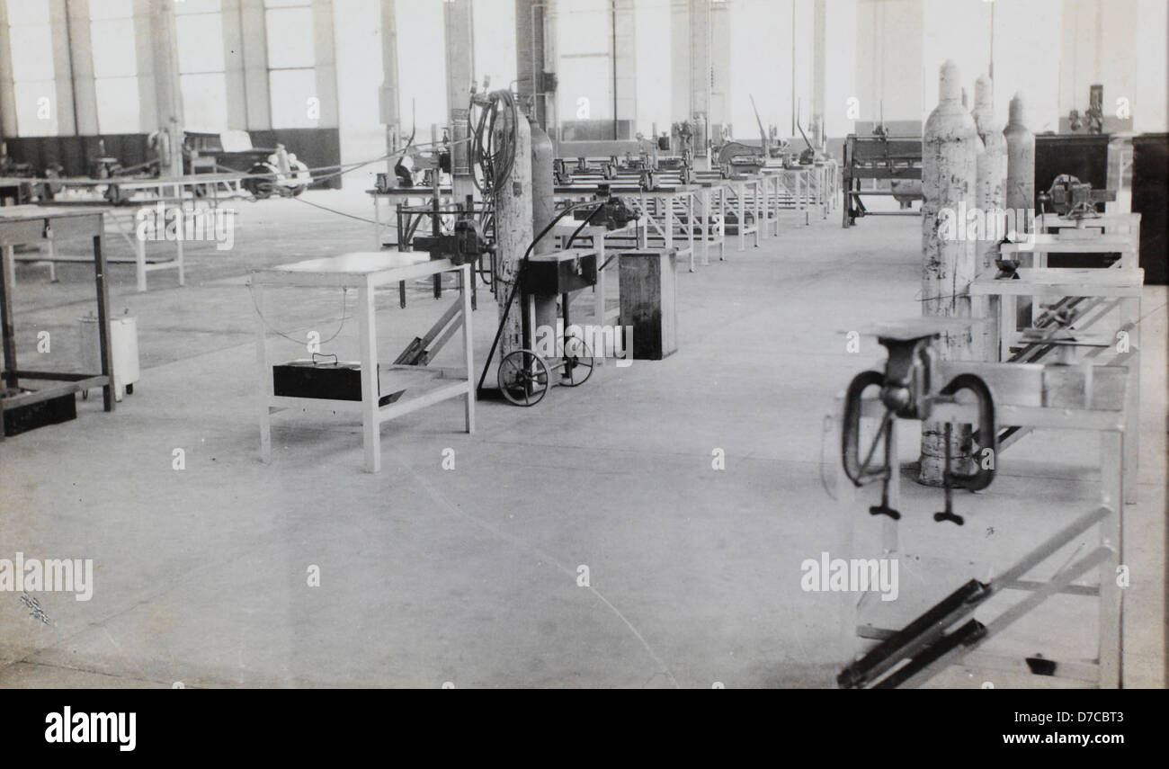 This factory floor highlights the industrial environment where military ...