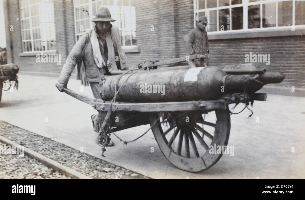 This image depicts a worker using a wheelbarrow, likely in a ...