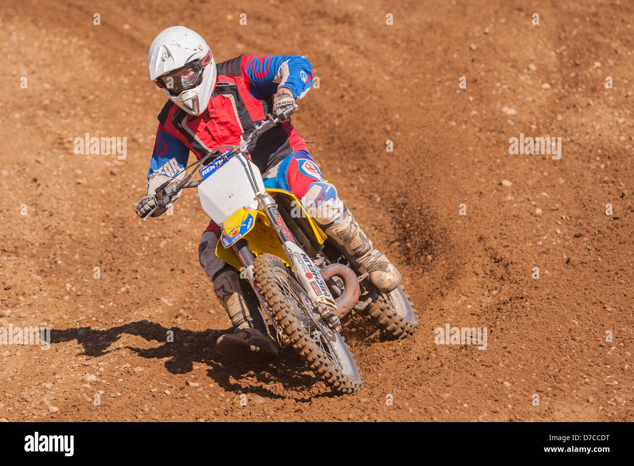 A motocross bike scrambler riding in the mud in the Uk Stock Photo - Alamy